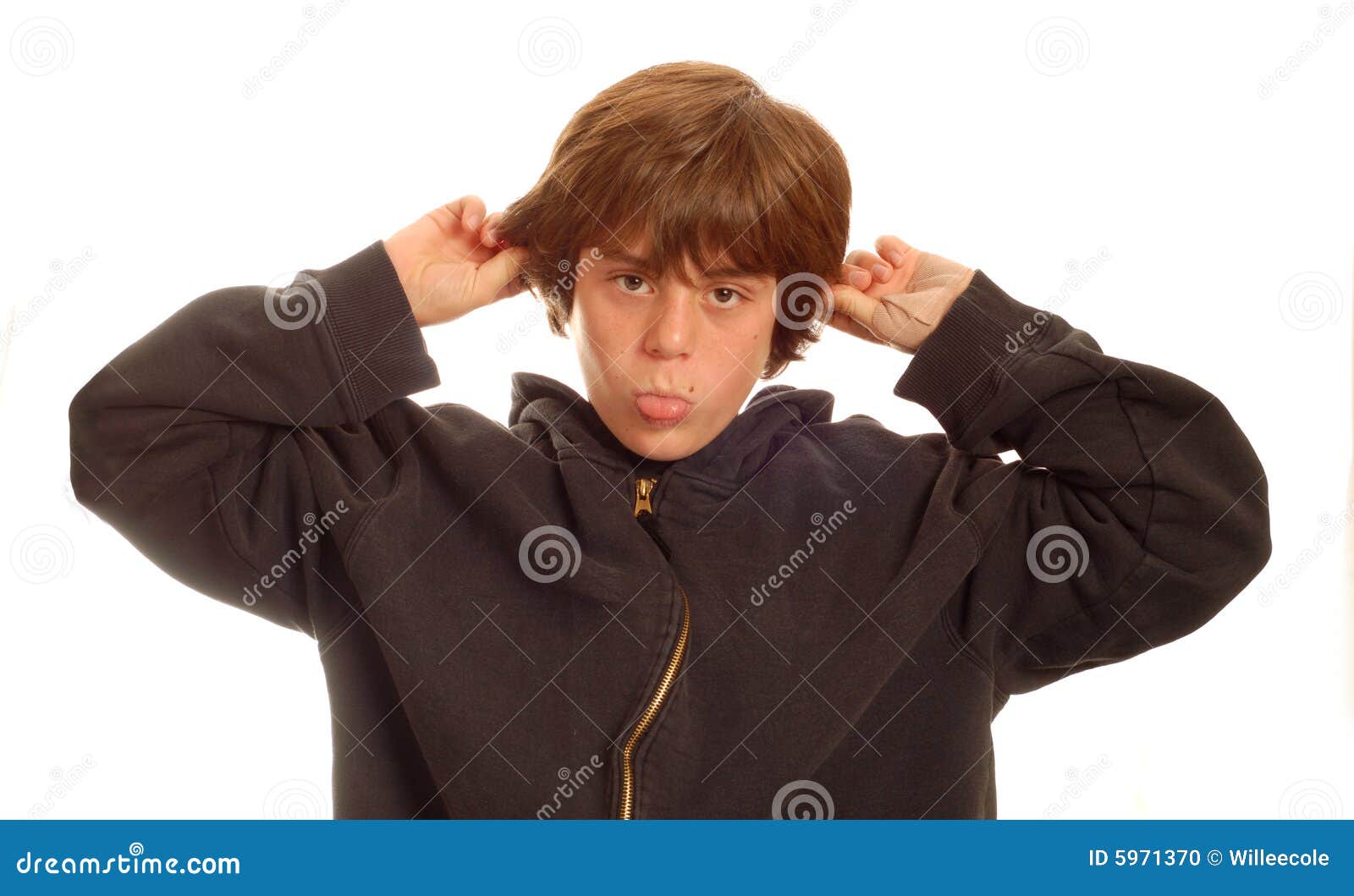 Teen boy making funny face stock photo. Image of male - 5971370