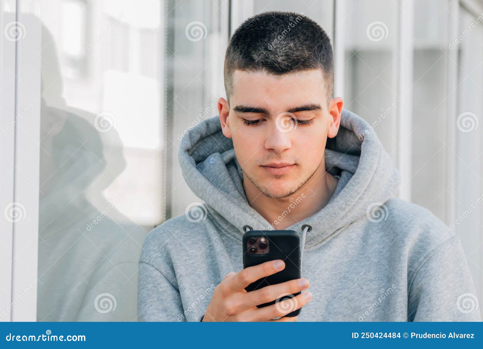 Boy with mobile phone stock photo. Image of photogenic - 250424484
