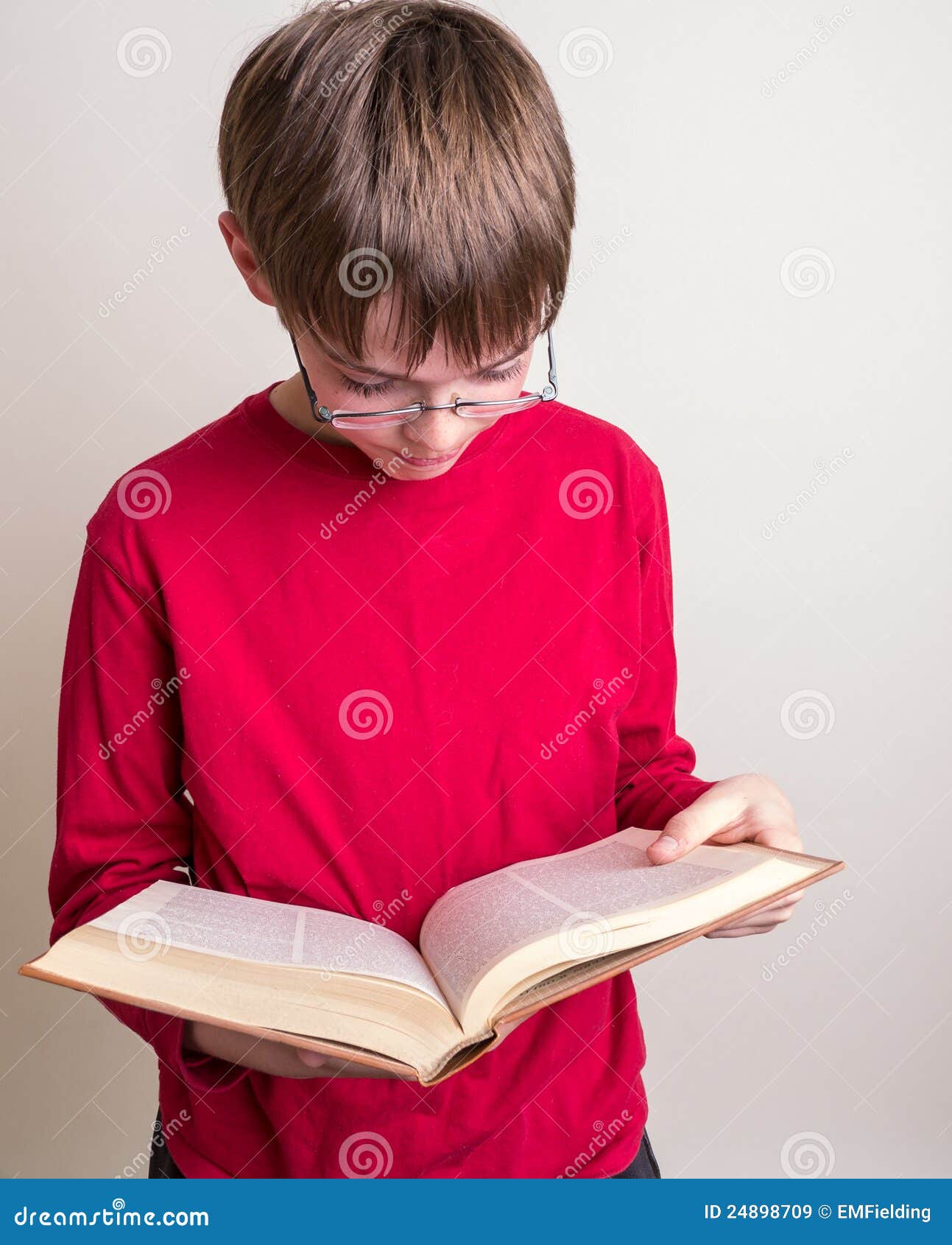 Teen Boy Reading Book stock image. Image of portrait - 24898709