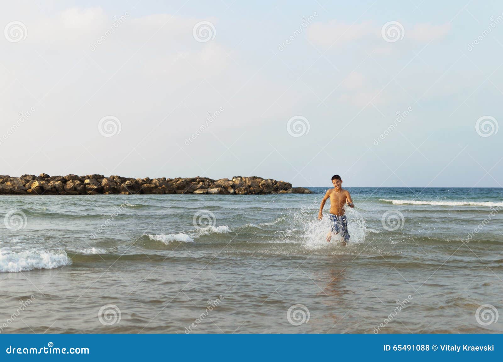Teen Boy is Running Along the Beach Stock Photo - Image of speed ...