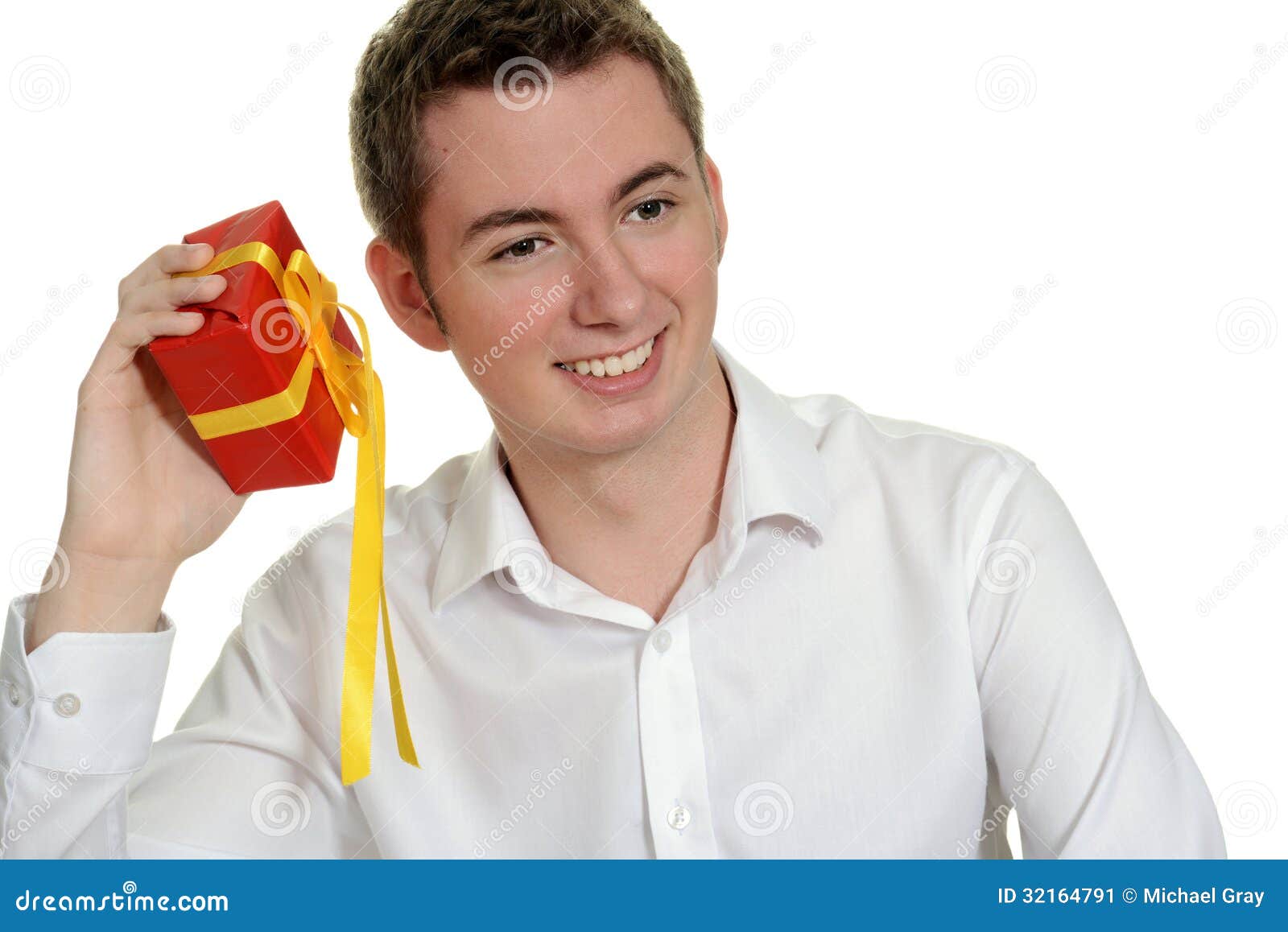 Teen Boy Shaking Christmas Present Stock Image - Image of isolated ...