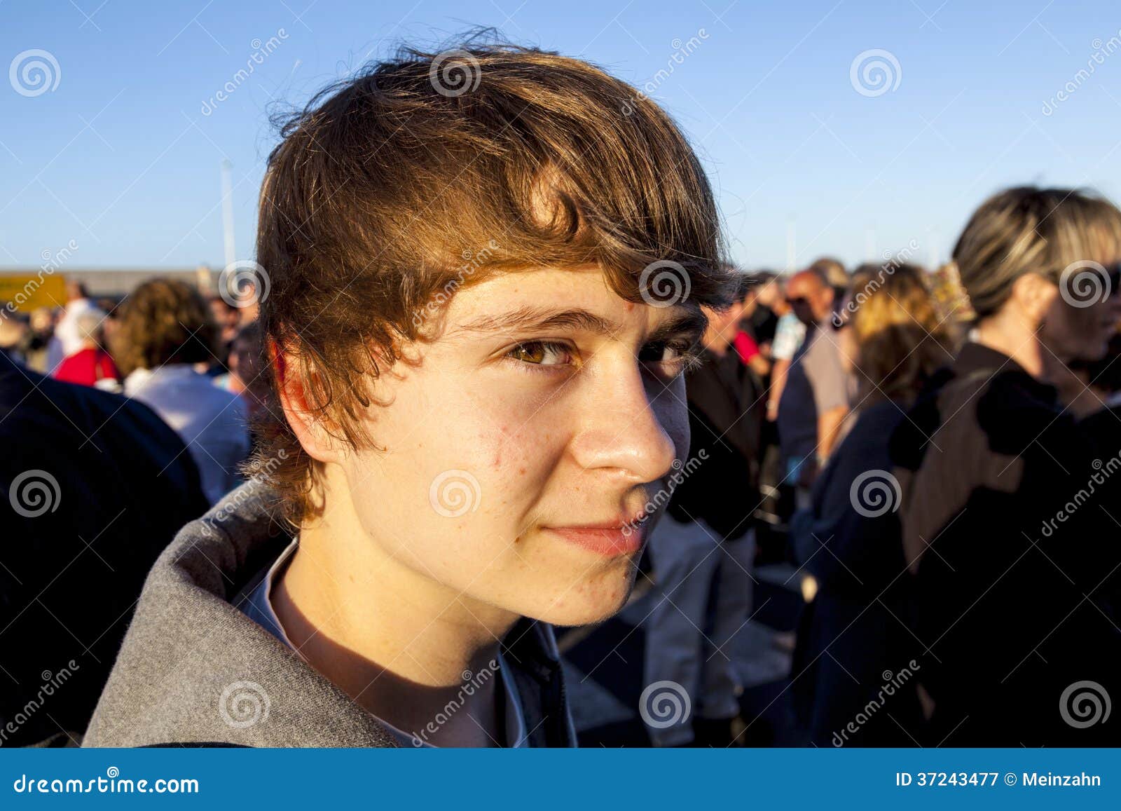 Teen Boy Standing in a Crowd of People Stock Image - Image of confident ...