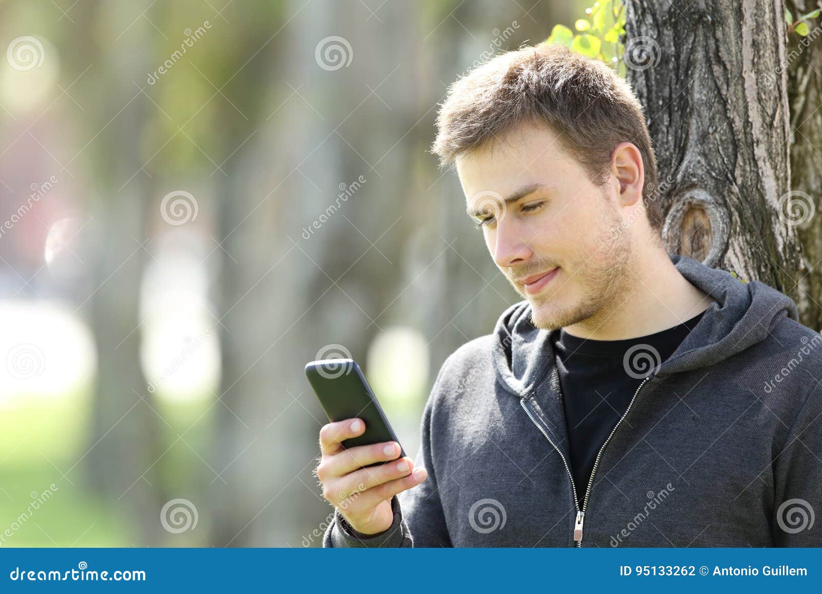 Teen Boy Using a Smart Phone Outdoors Stock Photo - Image of adolescent ...