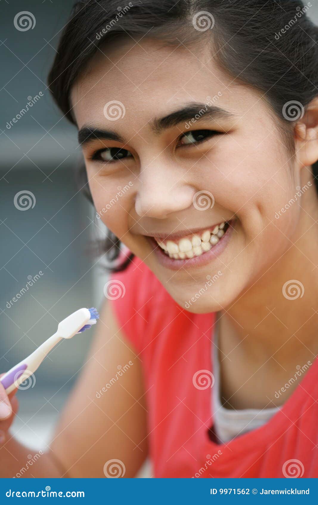 Teen brushing teeth stock photo. Image of brush, holding - 9971562