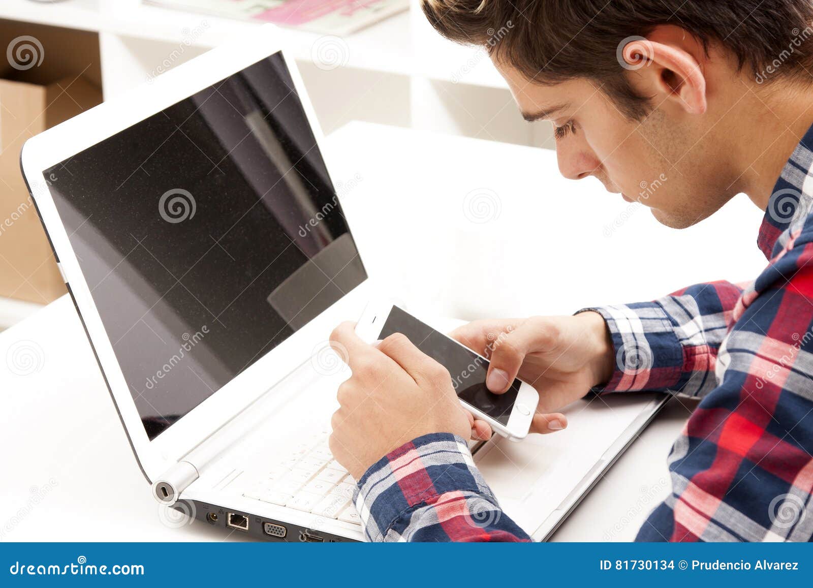 Teen on Cellphone with Laptop Stock Photo - Image of hand, office: 81730134