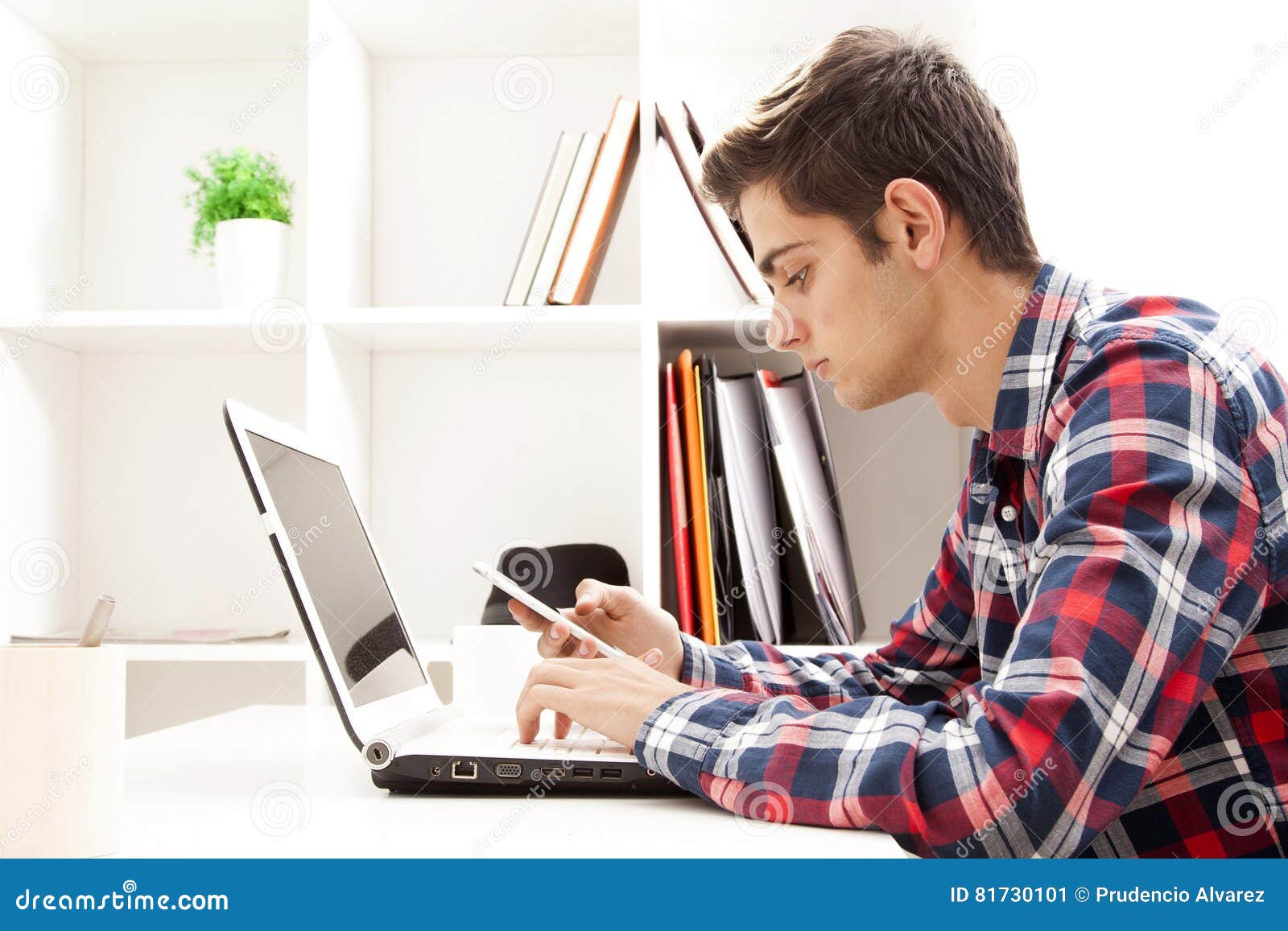 Teen on compuer in home stock image. Image of checked - 81730101