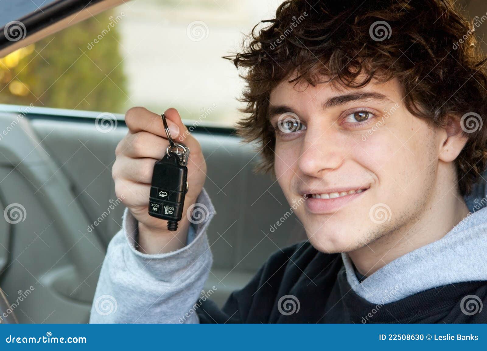 Teen driver holding keys stock photo. Image of glad, teen - 22508630