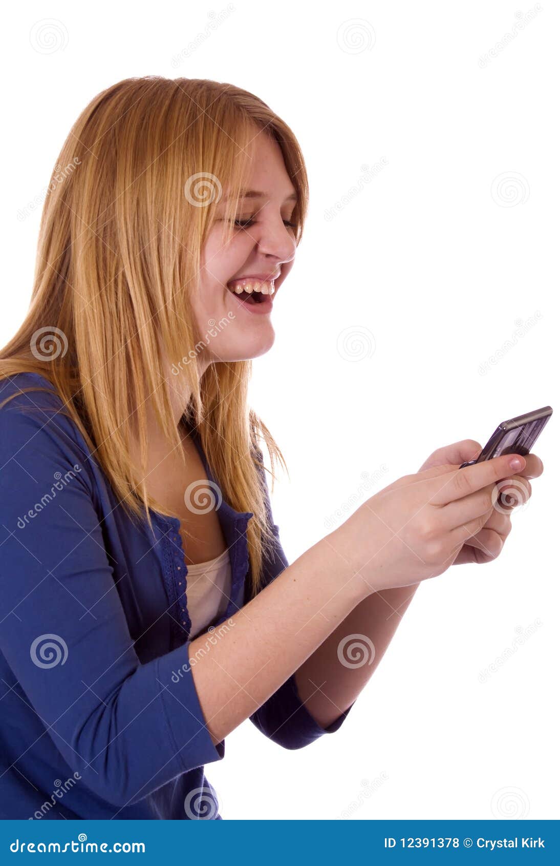 Teen gets a funny texted. stock photo. Image of keyboard - 12391378