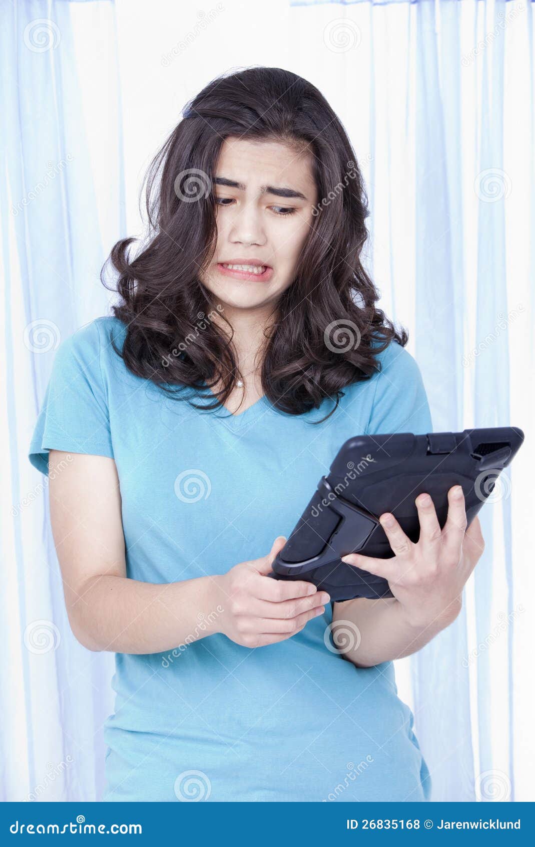 Teen Girl Disgusted at Computer Tablet Stock Photo - Image of blue ...