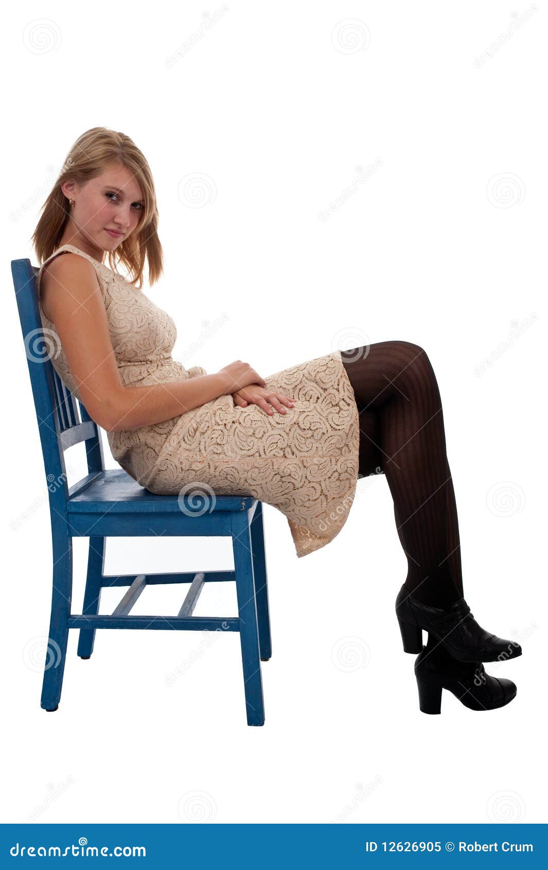 Teen Girl Sitting In A Blue Chair Stock Image 12626905