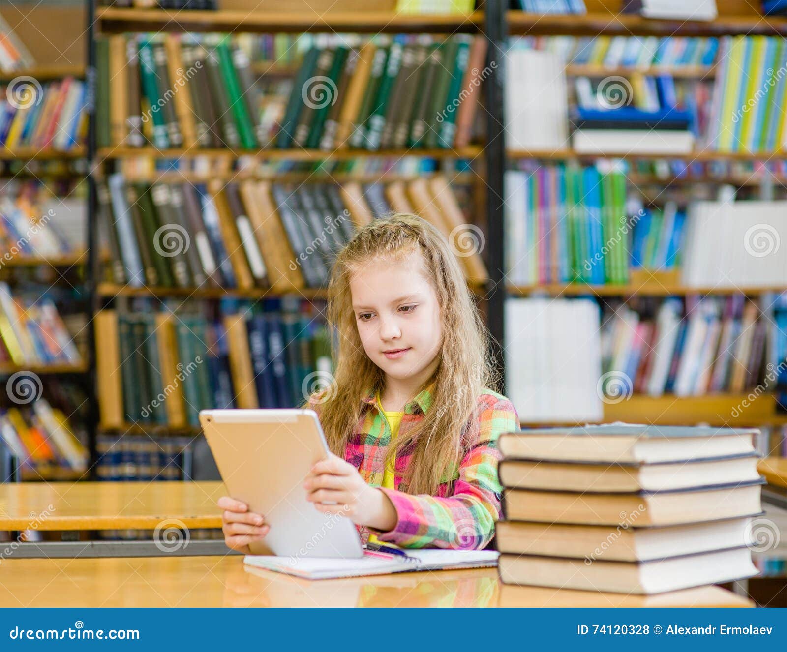 Teen Girl with Tablet Computer Working in Library Stock Photo - Image ...