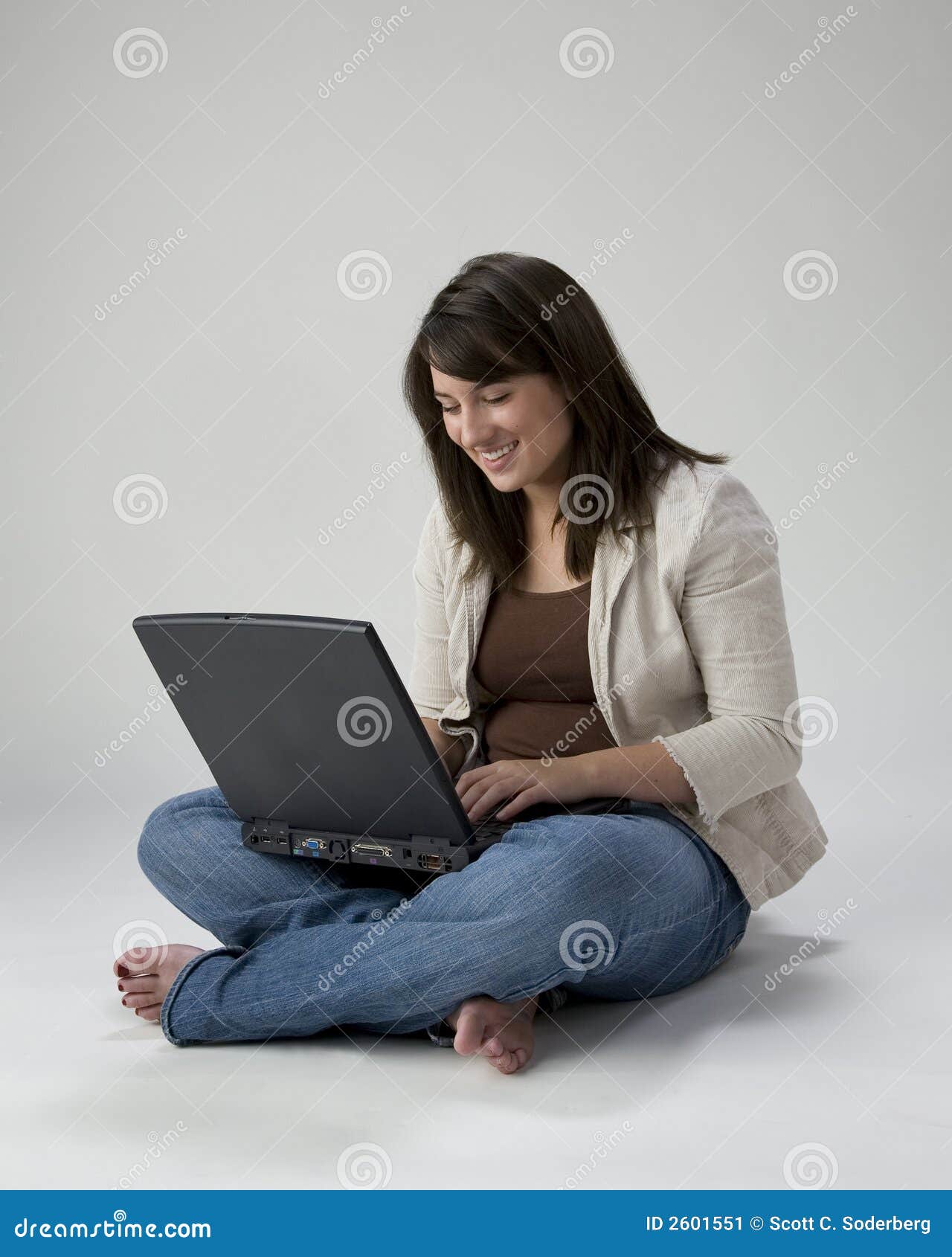 Teen girl using laptop stock image. Image of feet, electronics - 2601551