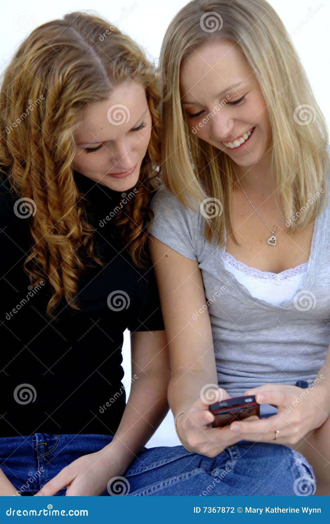 Teen Girls Sending Text Message Stock Photo - Image of share, send: 7367872