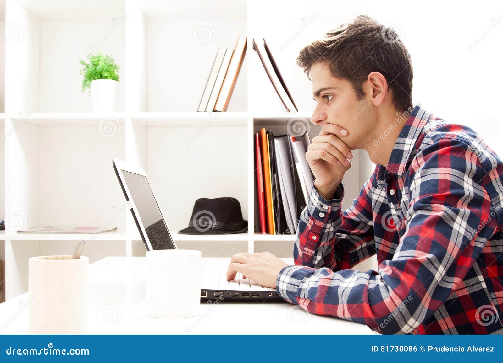 Teen on laptop computer stock photo. Image of serious - 81730086
