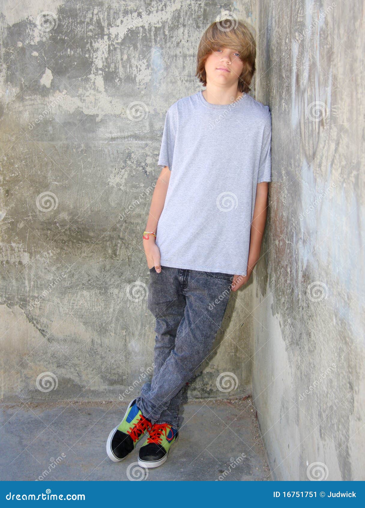 Teen Leaning on Wall stock image. Image of cute, shirt - 16751751