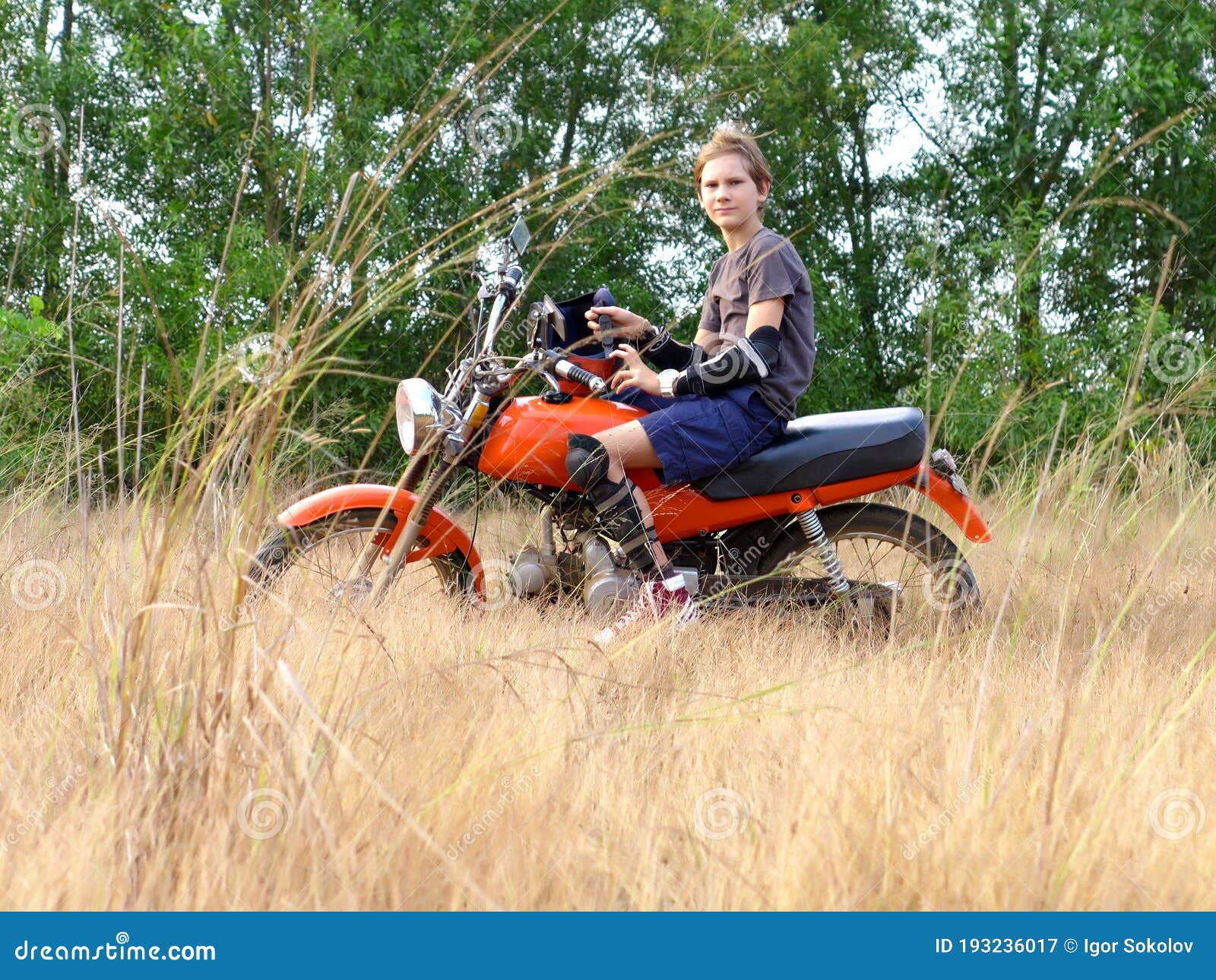 Teen Learning To Ride on Motorcycle 1 Stock Image - Image of cheerful ...