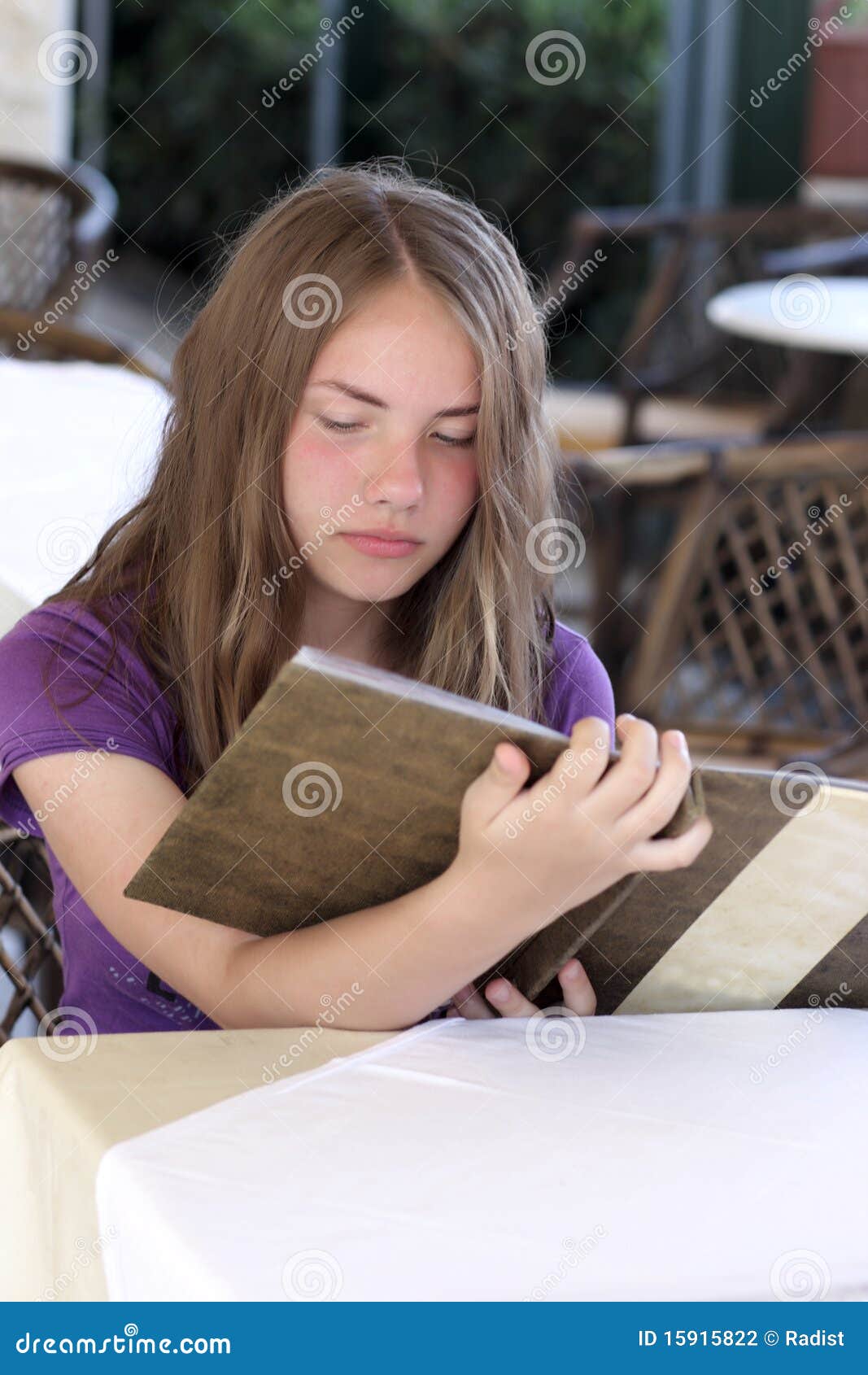 Teen reads menu stock photo. Image of looking, adolescence - 15915822
