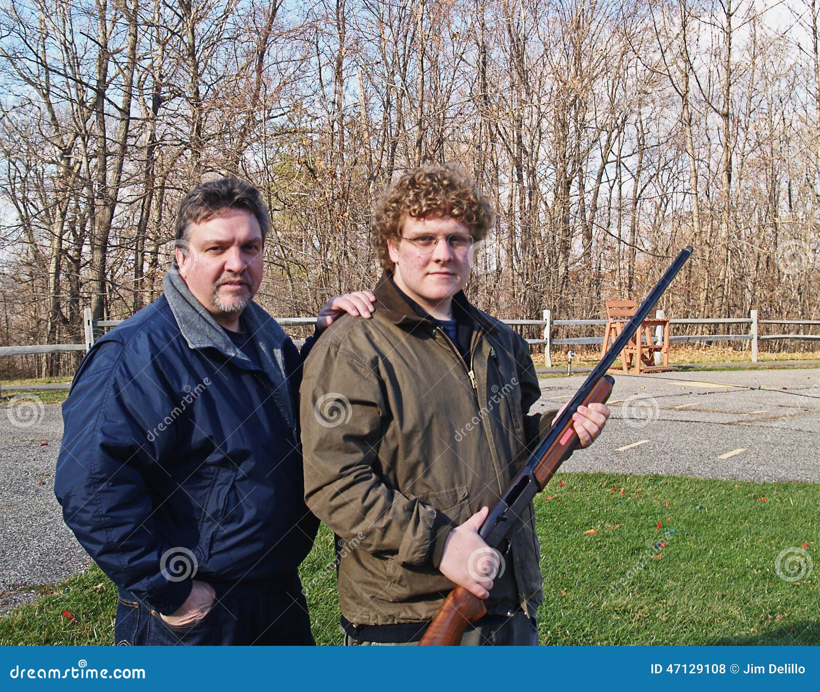 Teen with Shotgun with dad stock photo. Image of shoot - 47129108