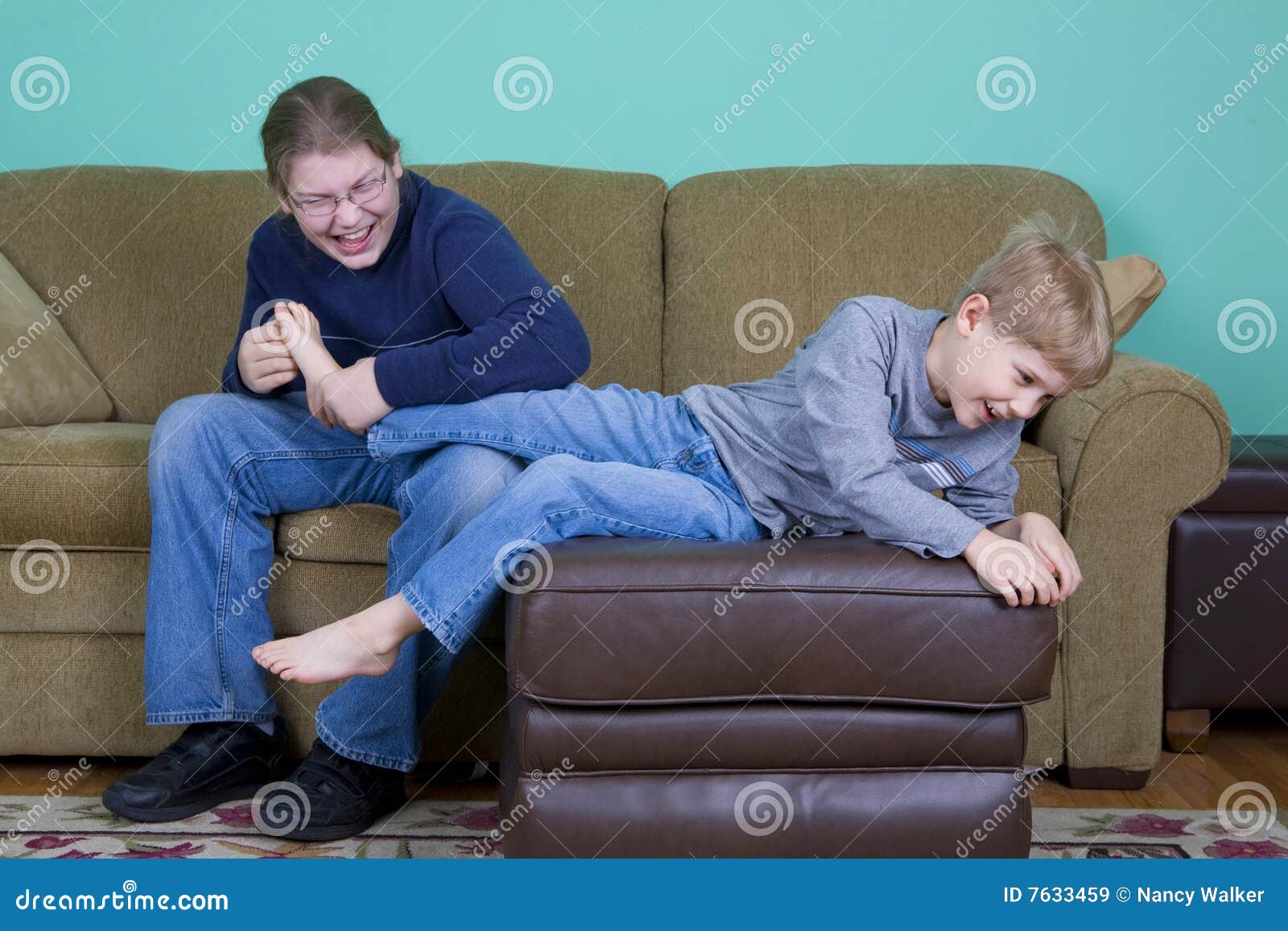 Teen Tickles Child stock image. Image of male, child, escaping - 7633459