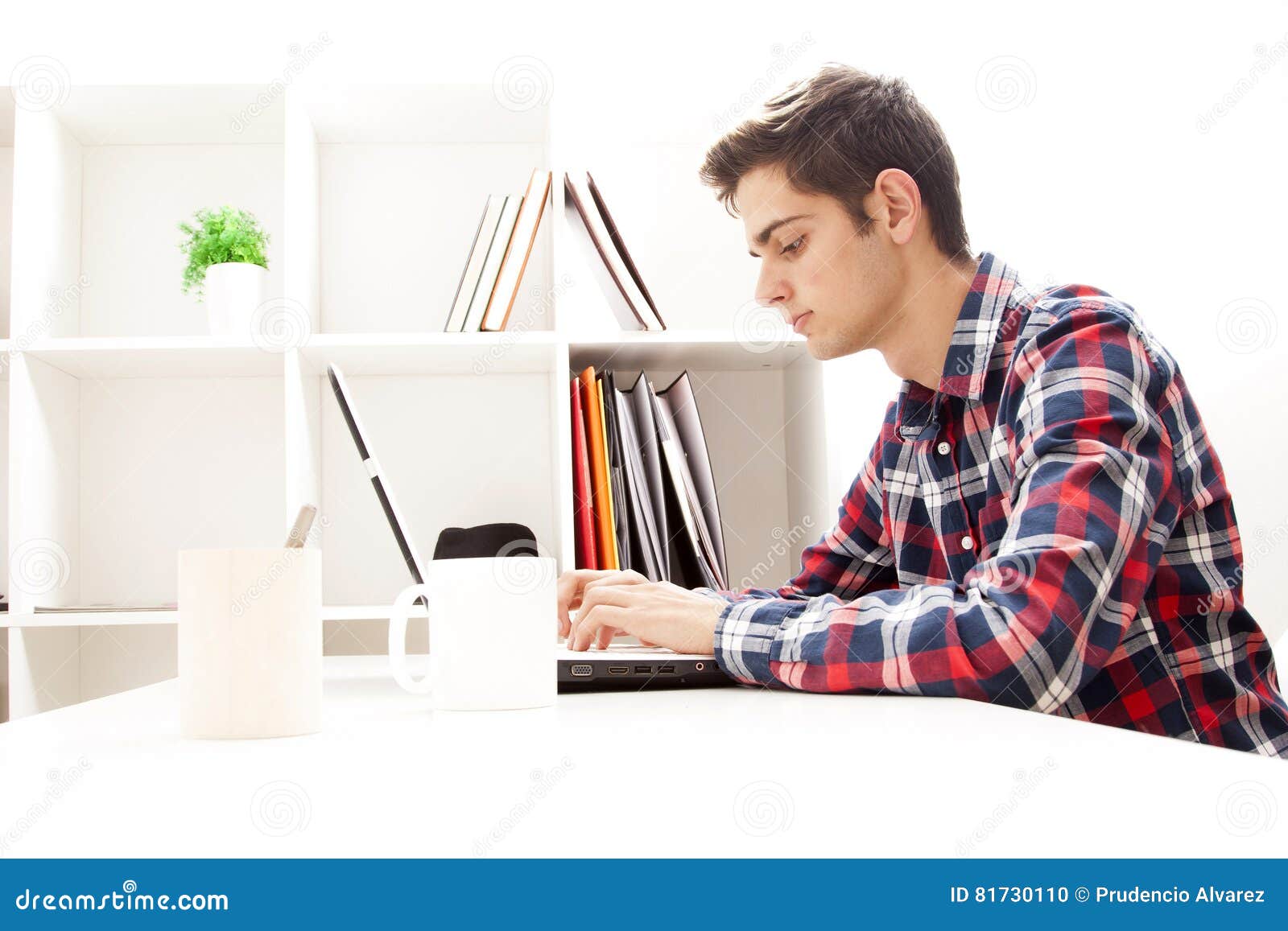 Teen typing on home laptop stock photo. Image of office - 81730110