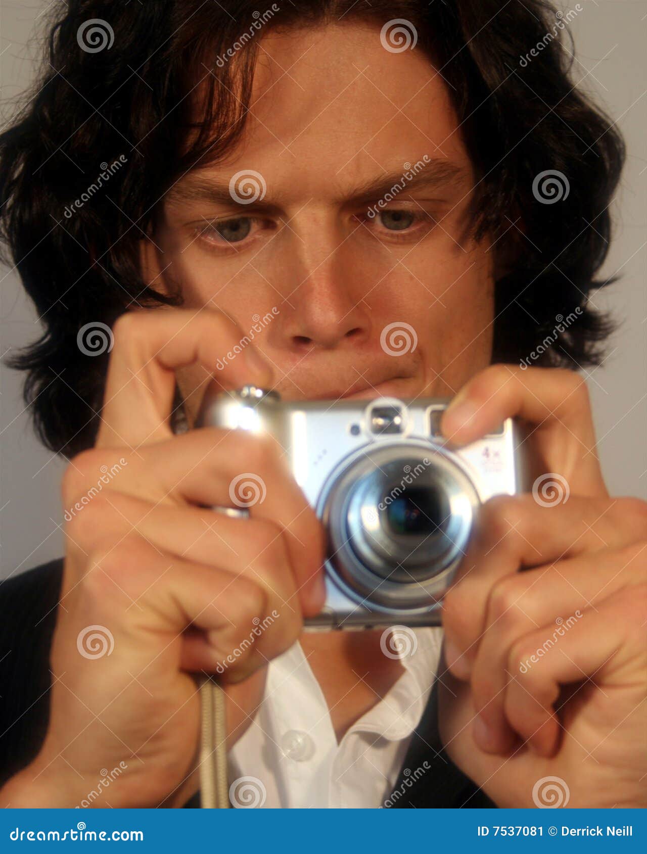 A Teen Uses a Camera stock image. Image of shirt, photographs - 7537081