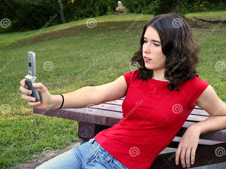 Teen using camera phone stock photo. Image of girl, picnic - 208052