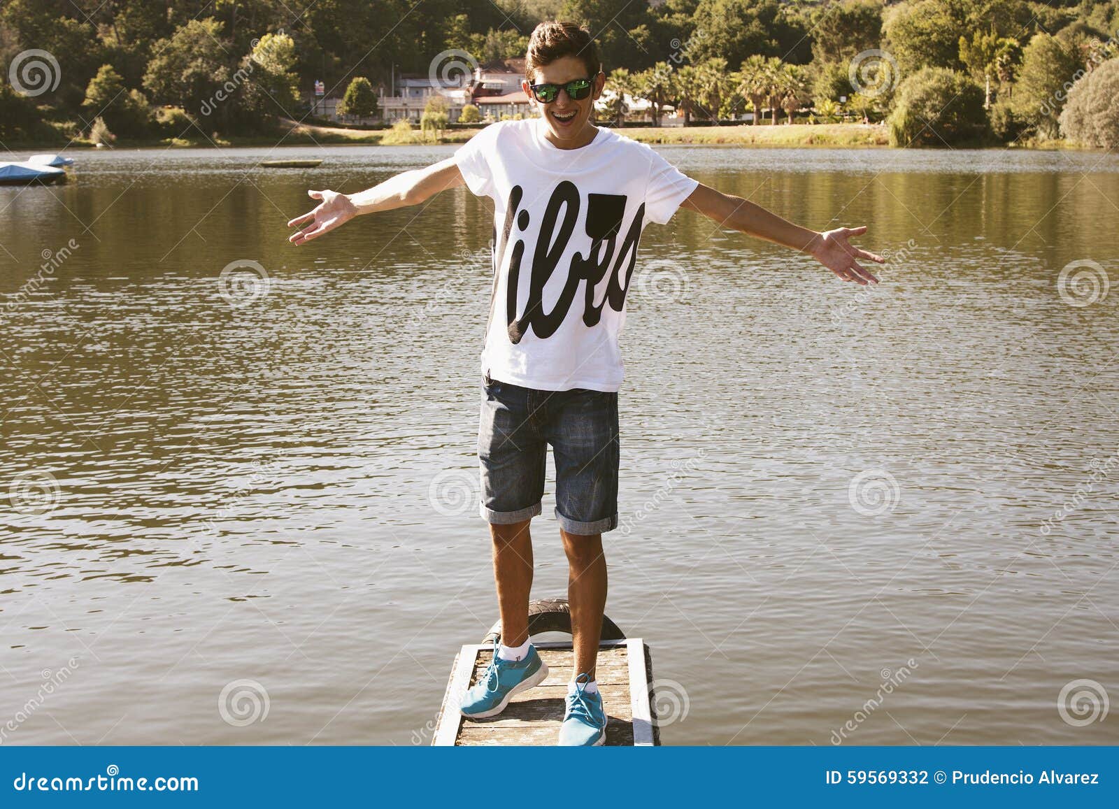 Teenage boy celebrating stock photo. Image of success - 59569332