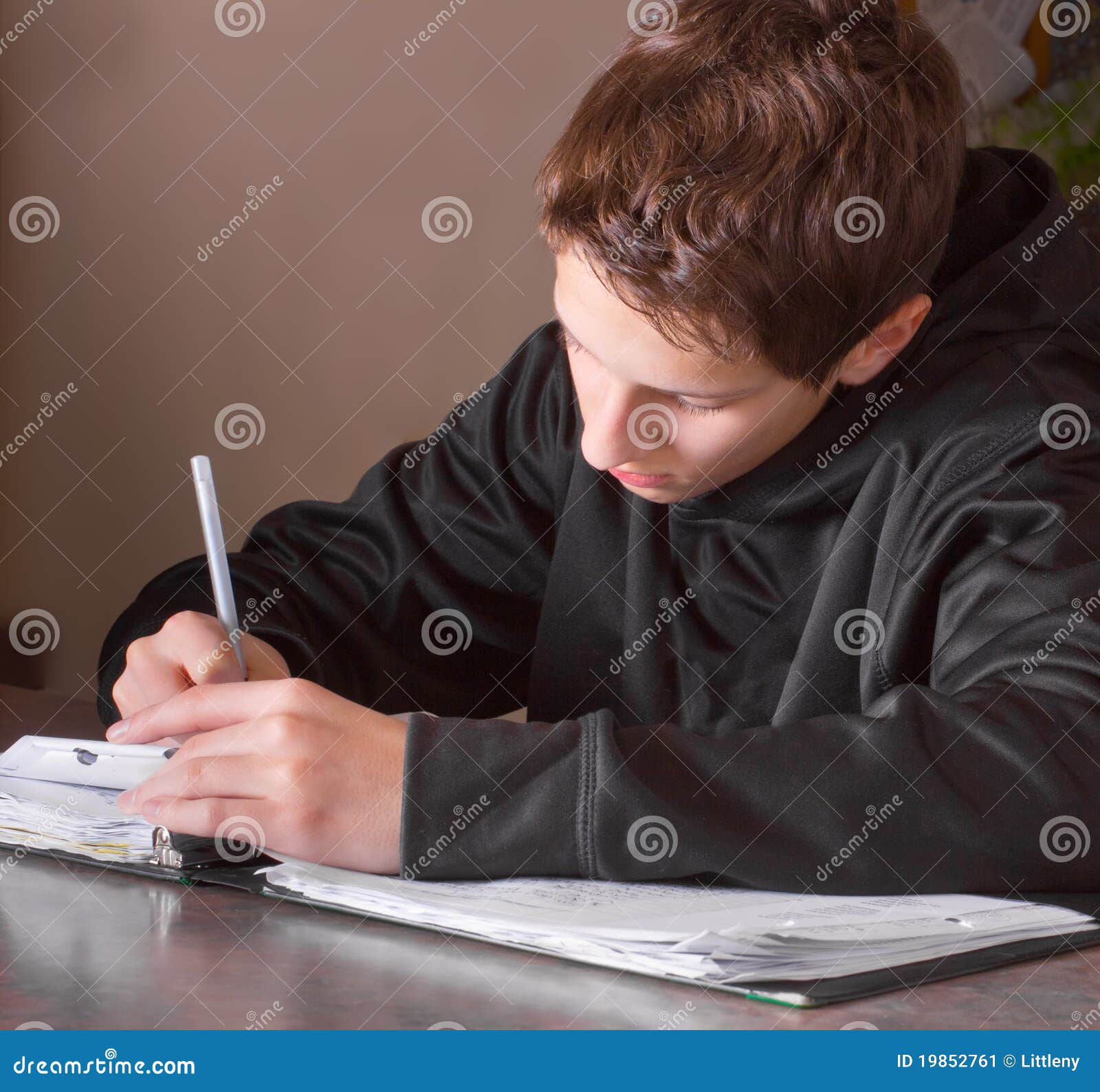 Teenage Boy Doing Homework stock image. Image of homework - 19852761