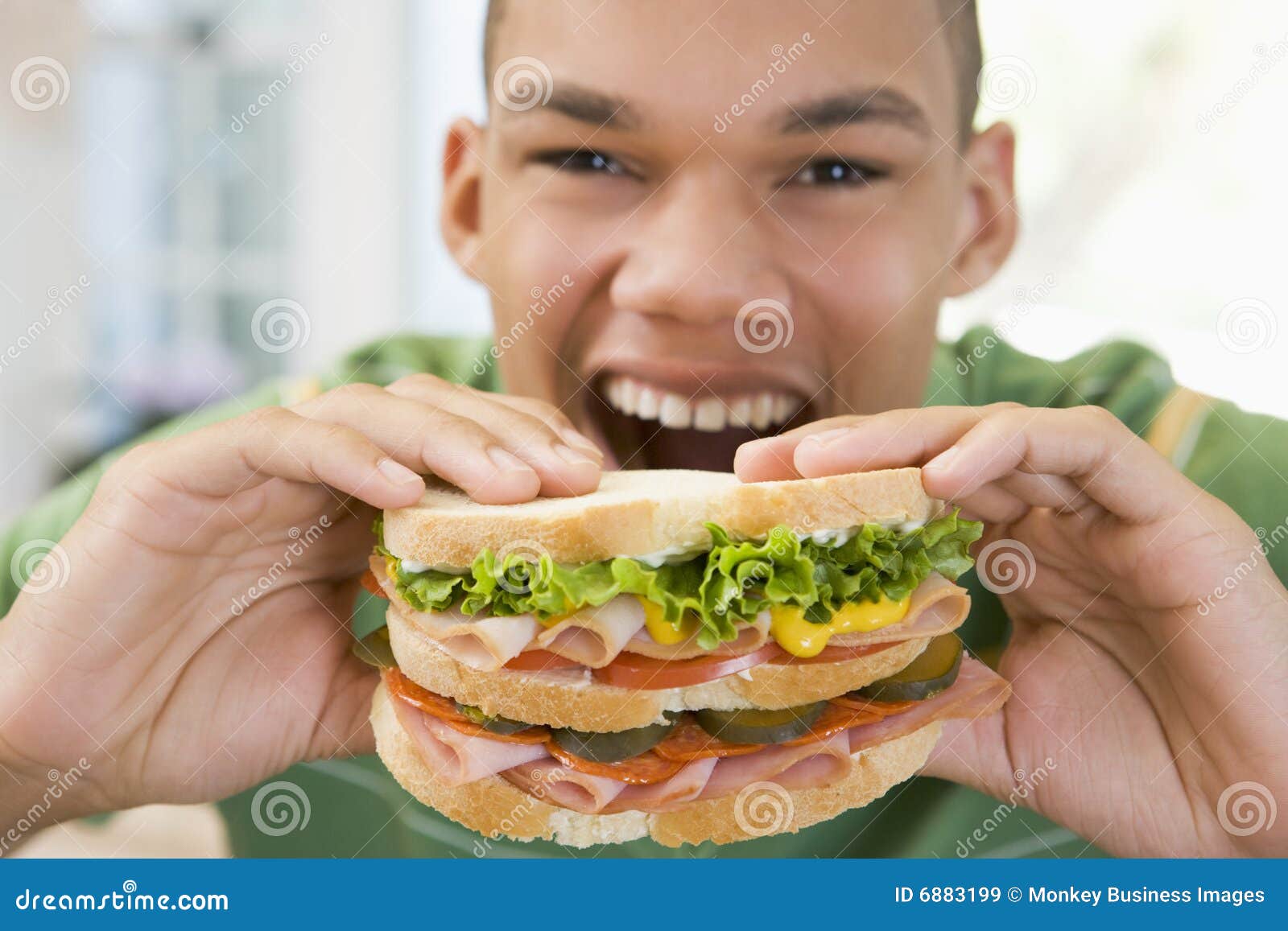 Teenage Boy Eating Sandwich Stock Image - Image of color, slice: 6883199