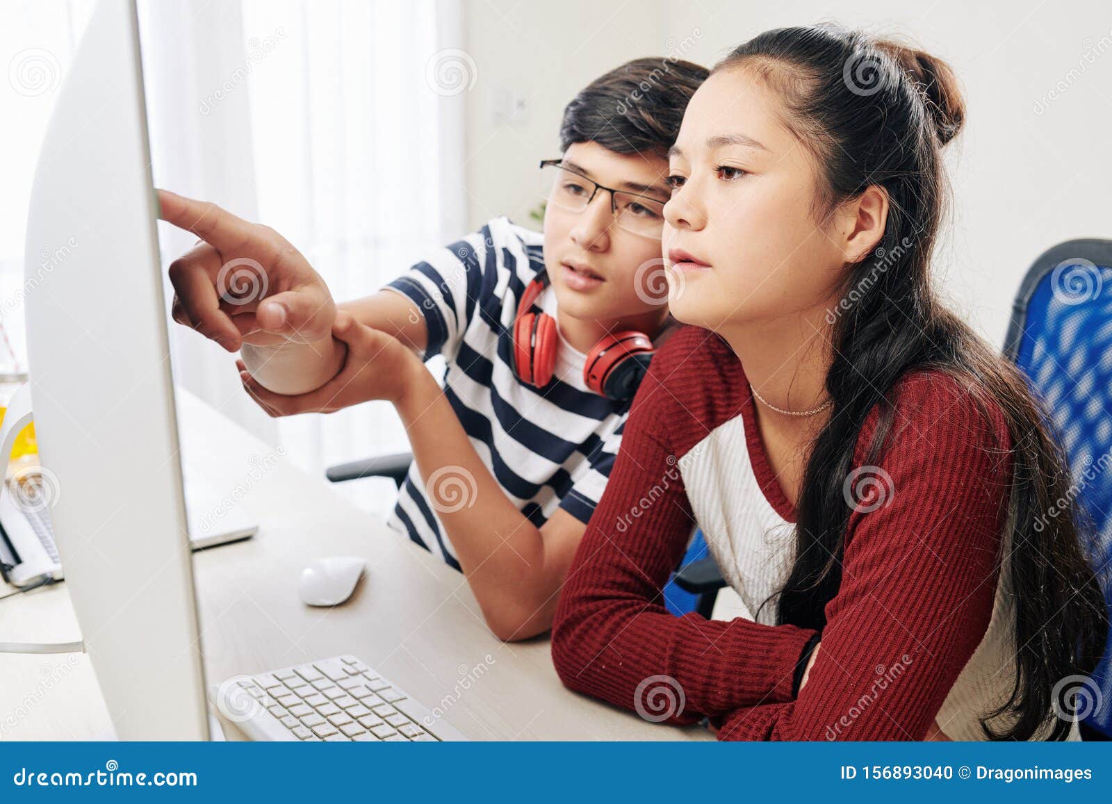 Teenage Boy in Glasses Explaining Part of Programming Code Stock Photo ...