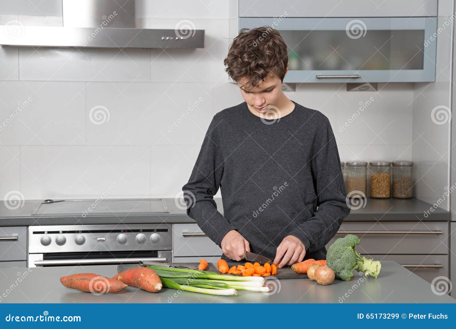 Teenage Boy in the kitchen stock image. Image of color - 65173299