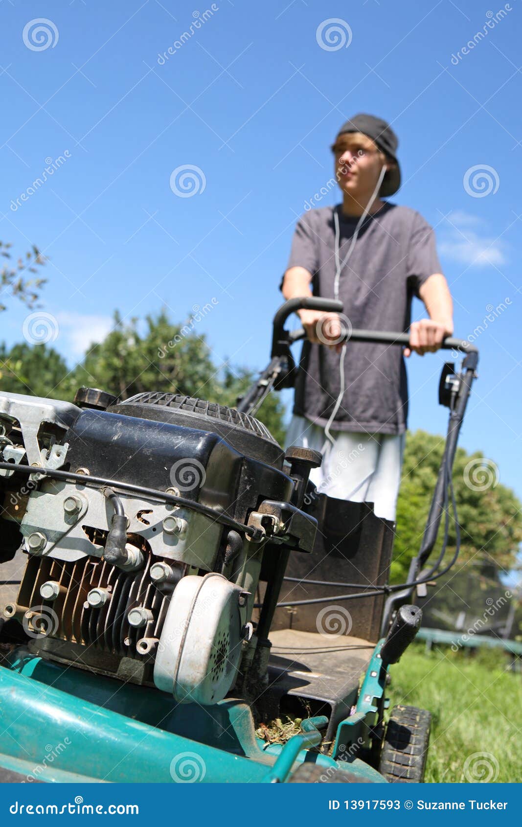 Teenage boy mowing lawn stock image. Image of adolescence - 13917593