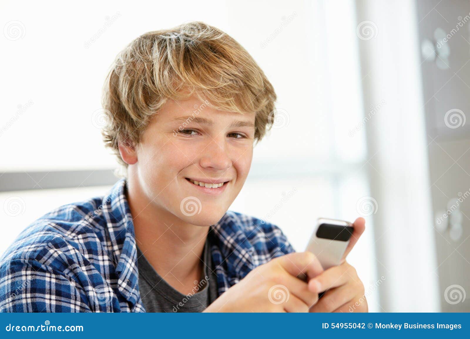 Teenage Boy with Phone in Class Stock Photo - Image of class, pupil ...