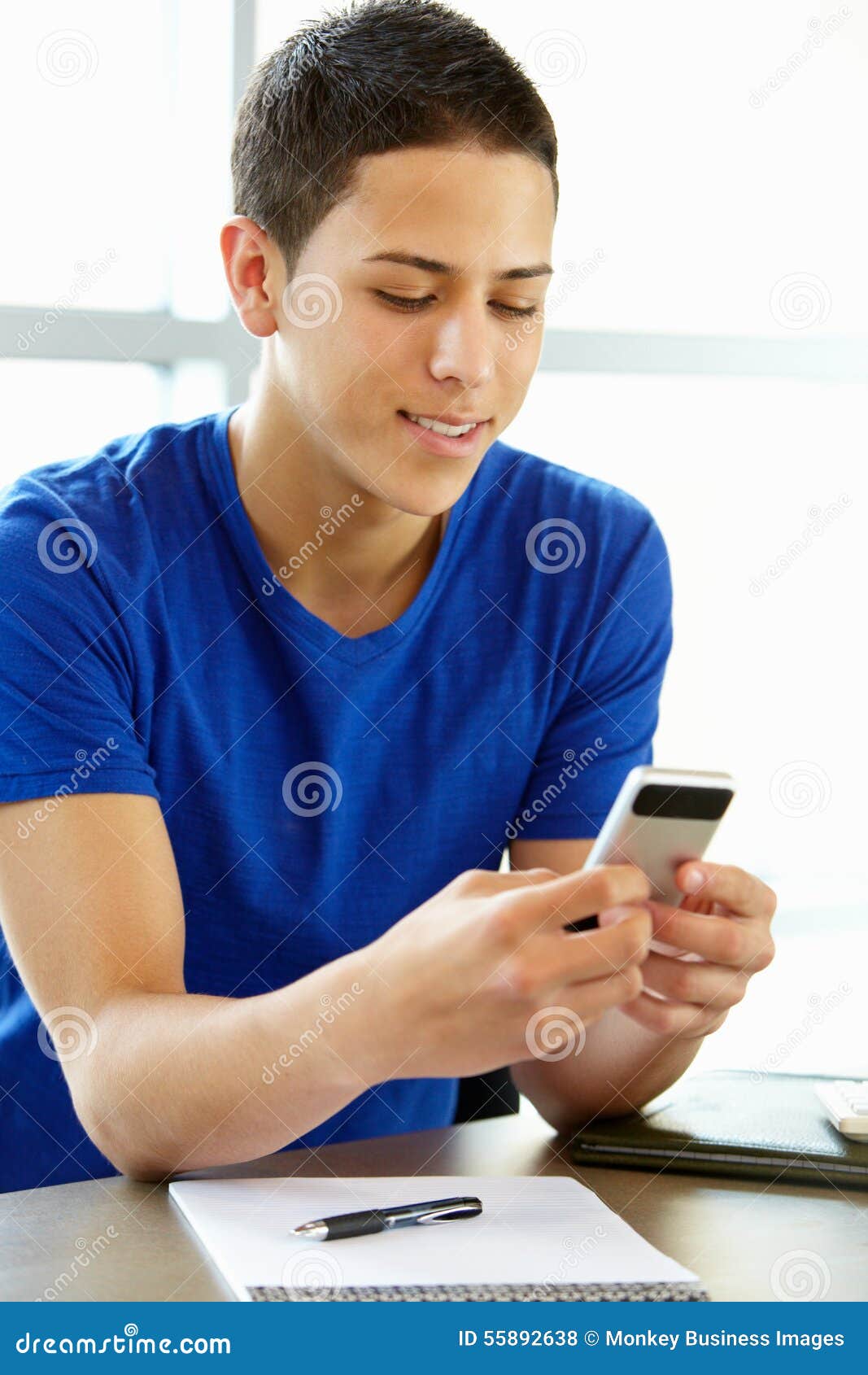 Teenage Boy with Phone in Class Stock Photo - Image of class, college ...