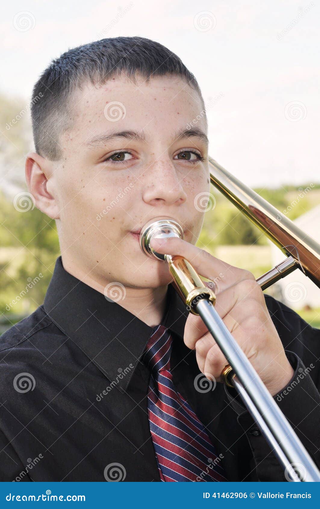 Teenage Boy Playing Trombone Stock Photo - Image of mouthpiece, horn ...