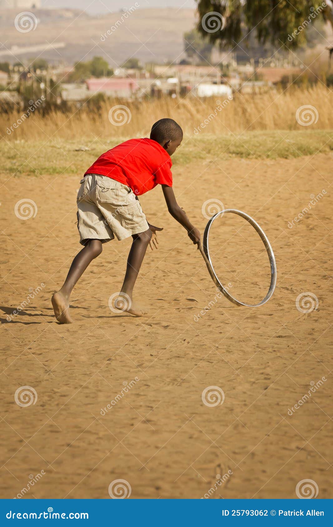 Teenage Boy Playing with Wheel - Rear View Stock Photo - Image of teen ...