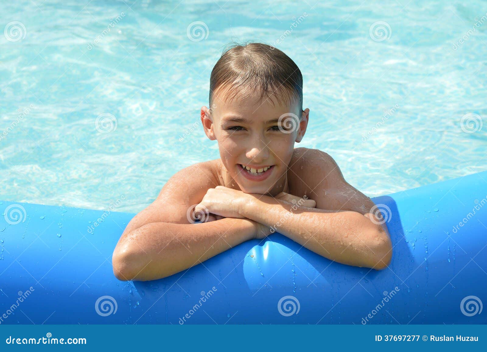 Teenage boy at pool stock image. Image of swim, blue - 37697277