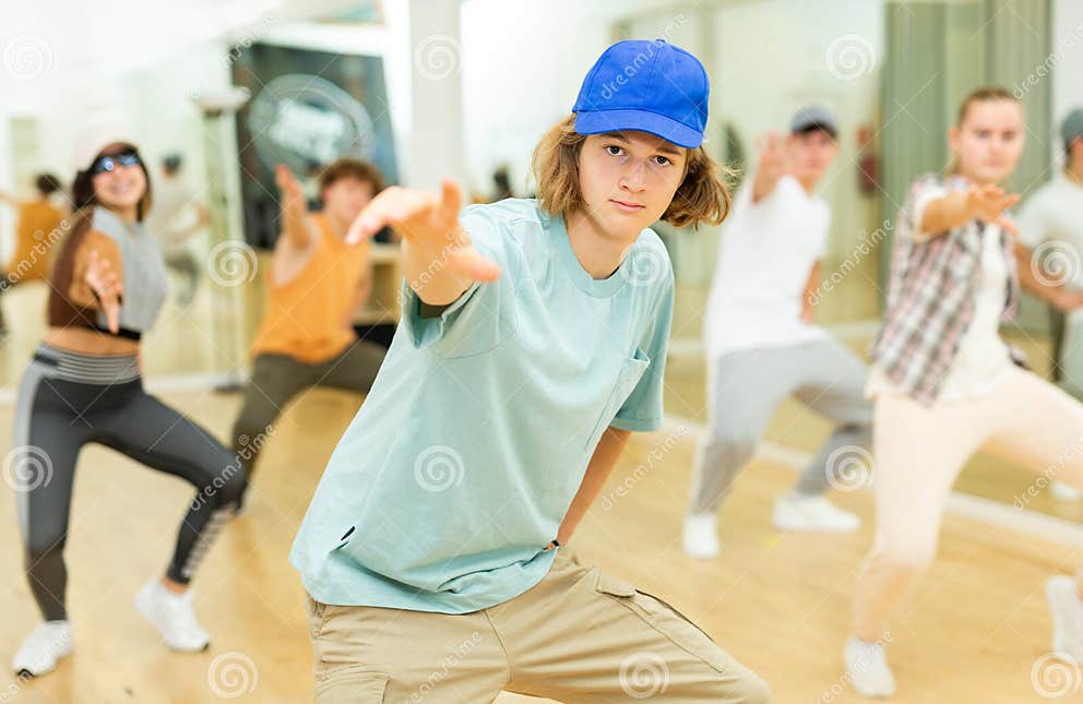 Teenage Boy Practicing Hip-hop Movements with Group in Studio Stock ... Teenage Boy Practicing Hip-hop Movements with Group in Studio Stock ...