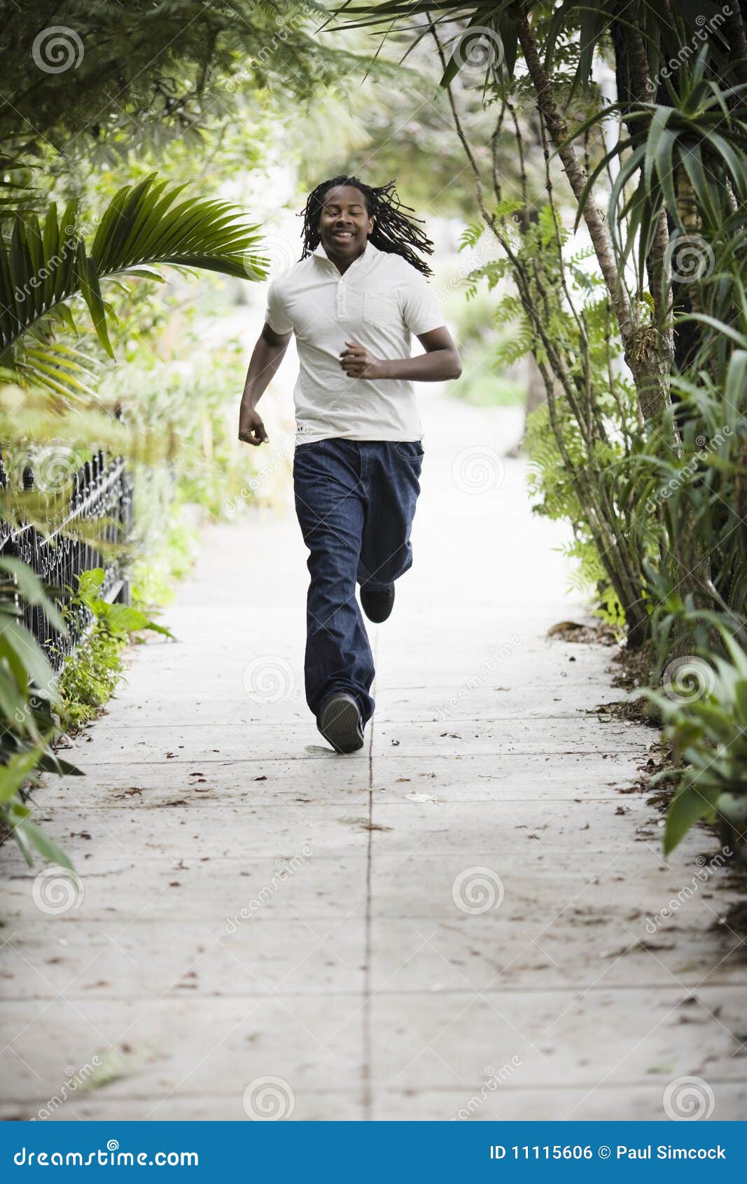 Teenage Boy Running on Sidewalk Stock Photo - Image of enjoyment ...