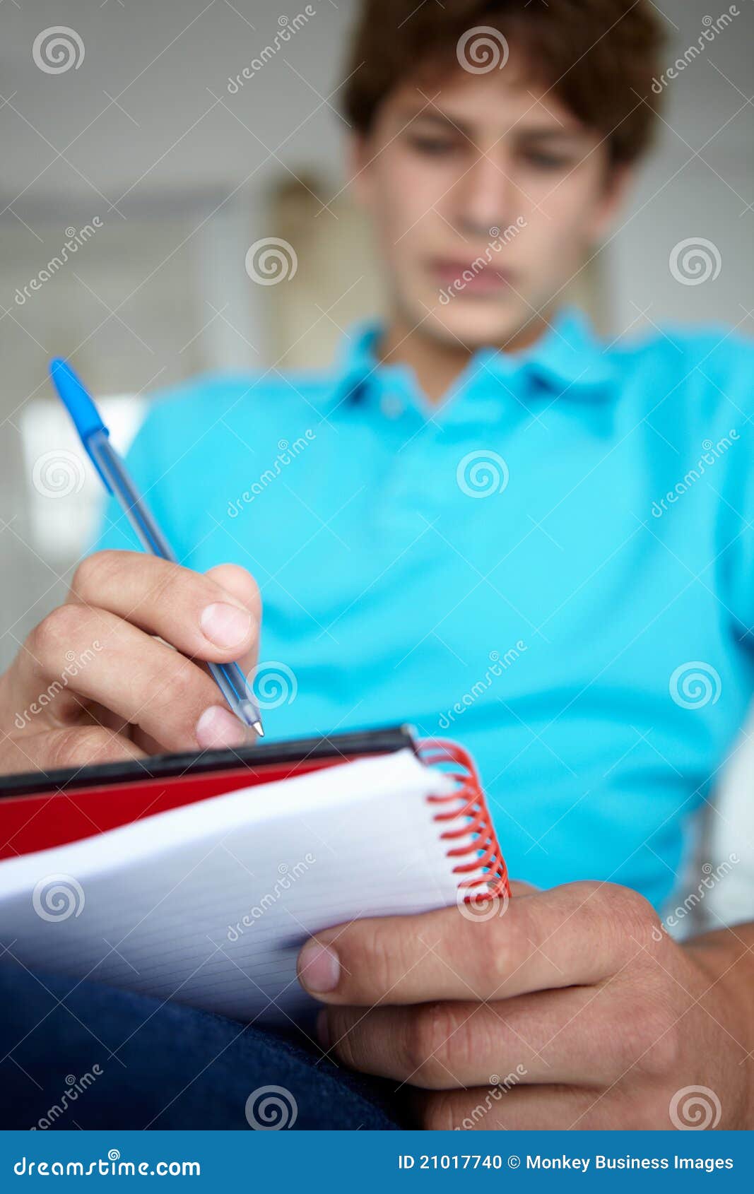 Teenage Boy Sat Writing in Notebook Stock Photo - Image of homework ...
