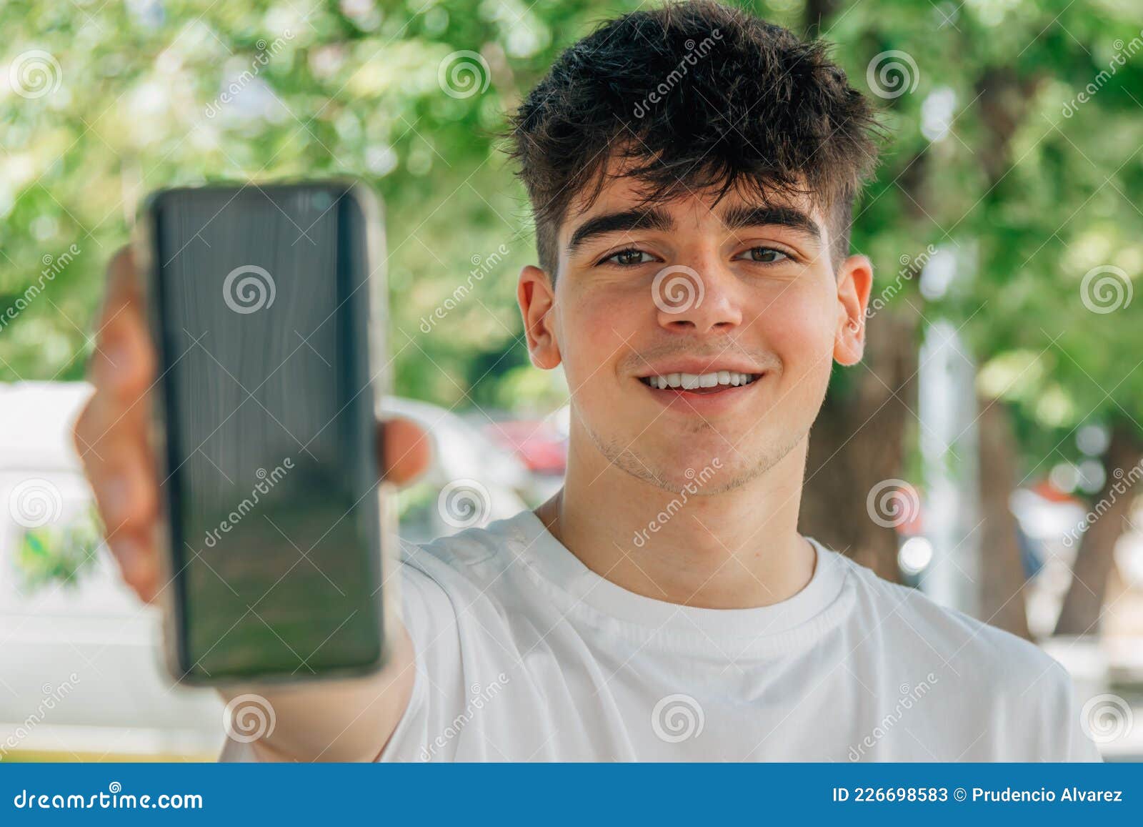 Boy showing mobile phone stock image. Image of presentation - 226698583