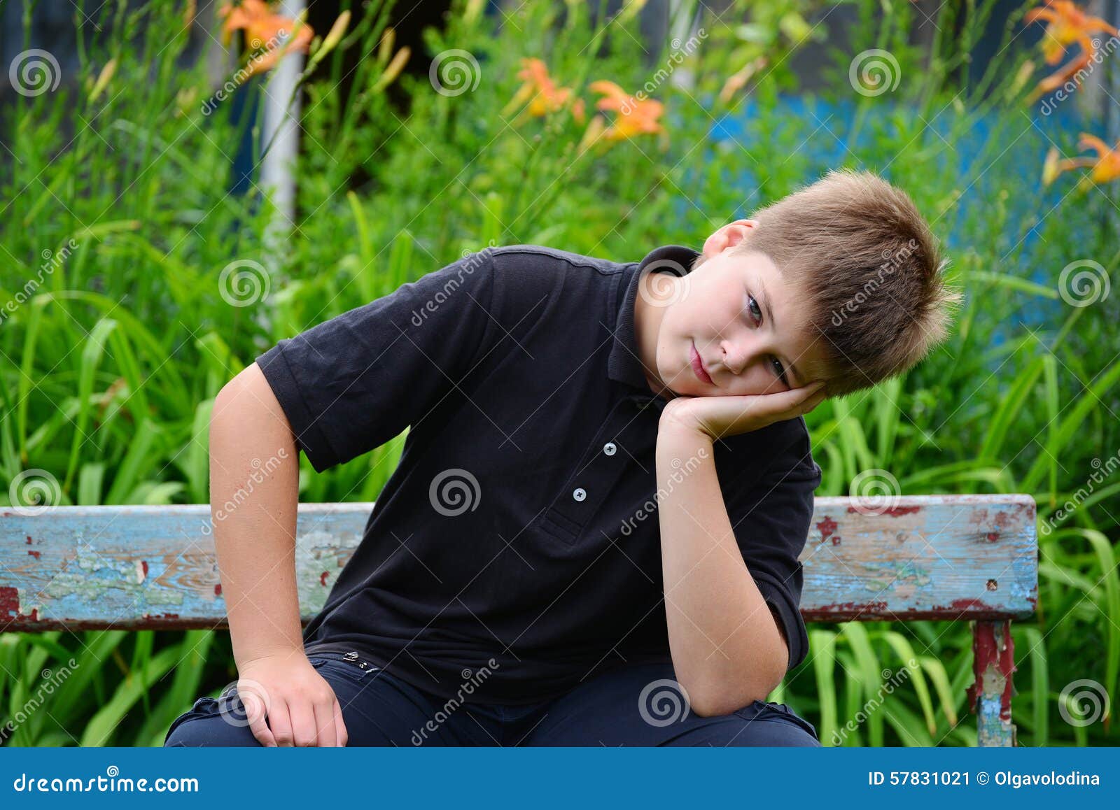 Teenage Boy Sitting on a Bench Stock Image - Image of bench, male: 57831021