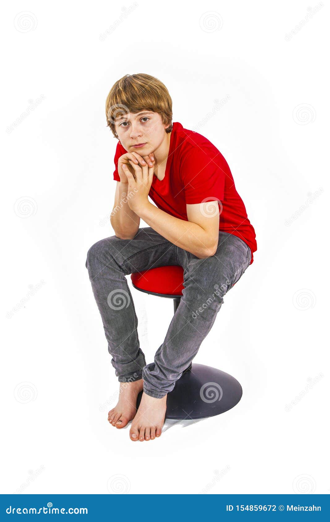 Teenage Boy Sitting on a Stool Stock Photo - Image of space, portrait ...