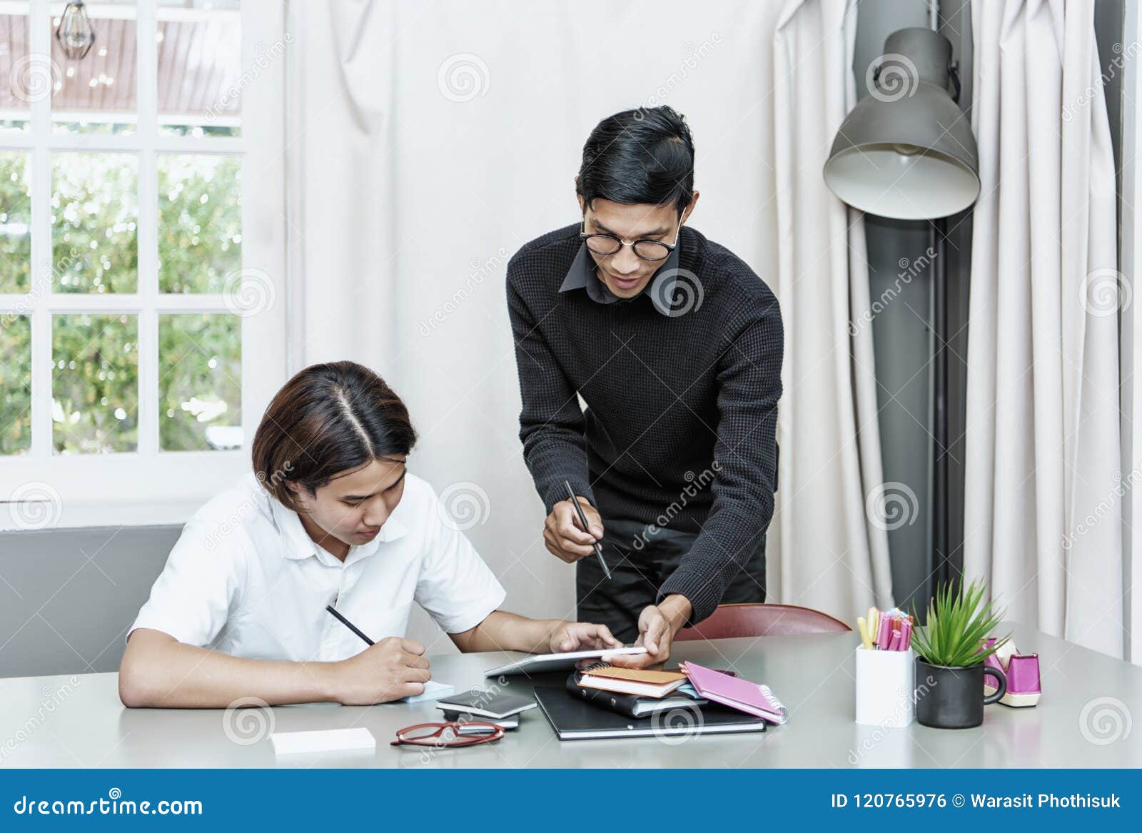 Teenage Student in Classroom with Tutor Stock Photo - Image of student ...