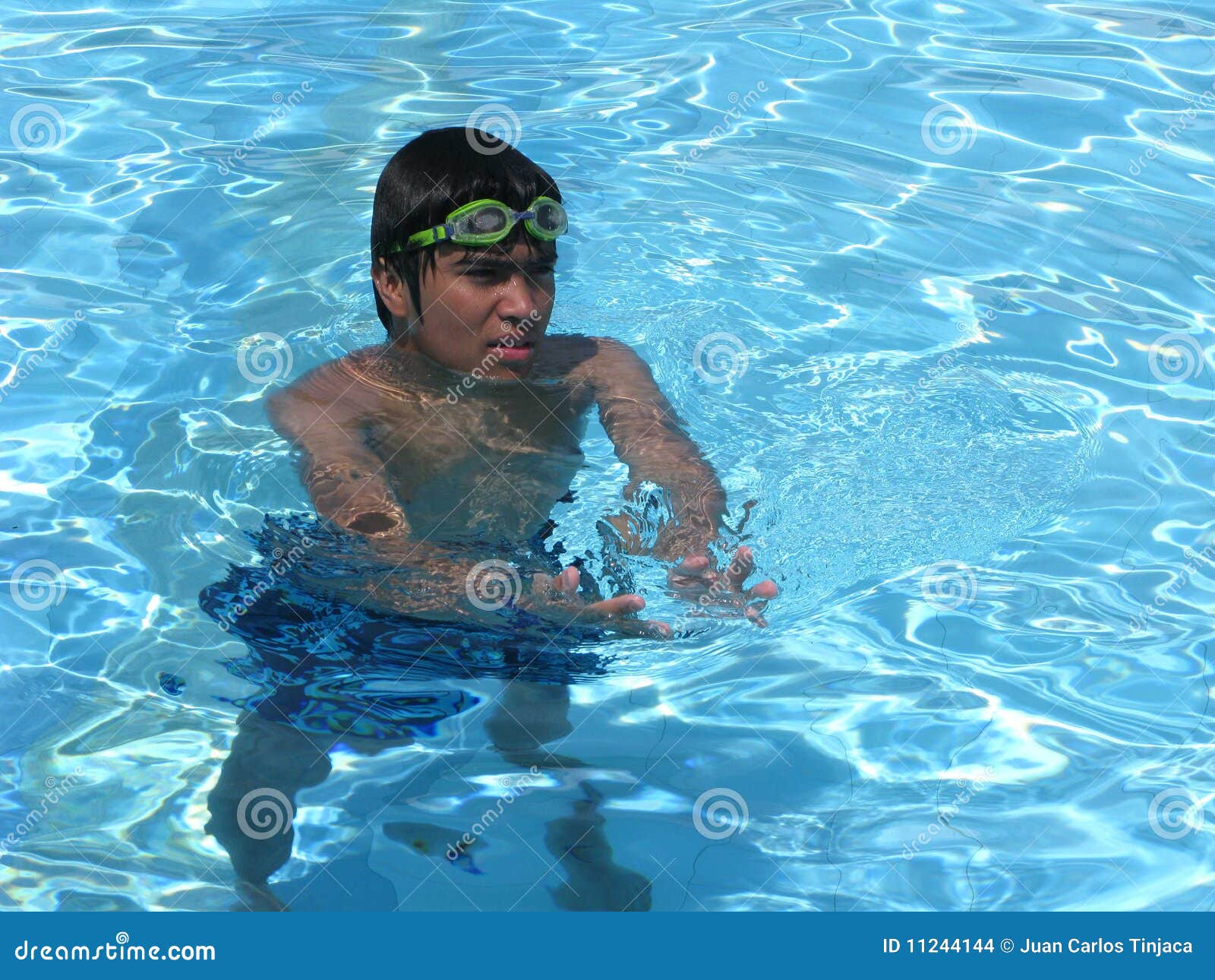 Teenage boy swimming stock photo. Image of teen, young - 11244144