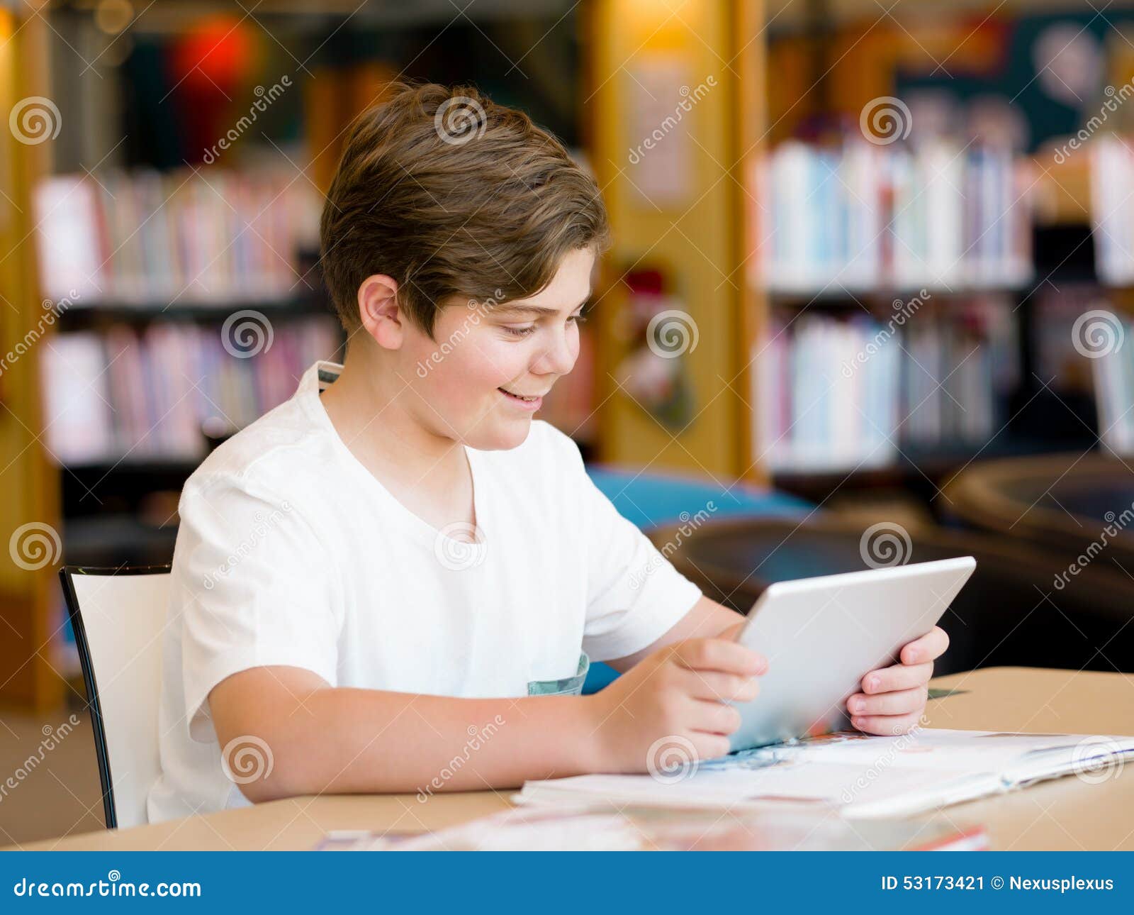Teenage Boy with Tablet in Library Stock Image - Image of interior ...