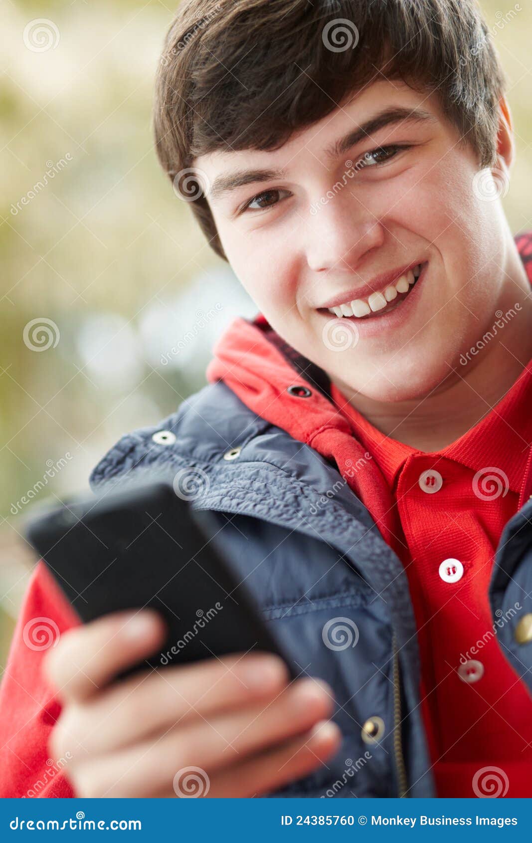 Teenage Boy Texting on Smartphone Stock Photo - Image of male ...