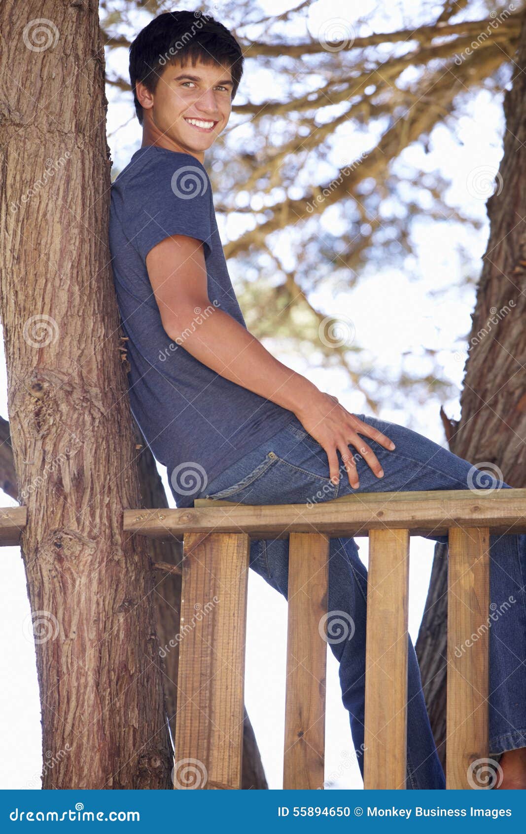 Teenage Boy in Treehouse stock photo. Image of vertical - 55894650