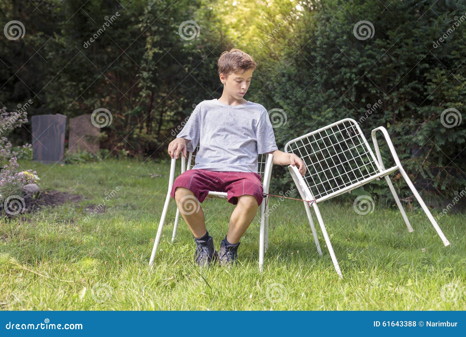 Teenage Boy with Two Chairs Stock Photo - Image of confident, handsome ...