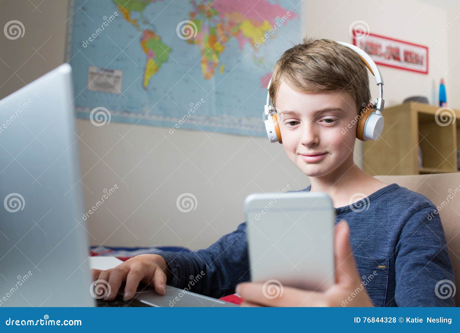 Teenage Boy Using Technology in Bedroom Stock Photo - Image of message ...